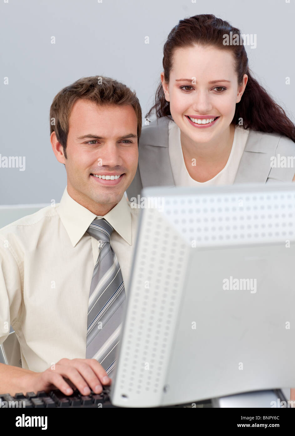 Young manager checking her employee's work in the office Stock Photo ...