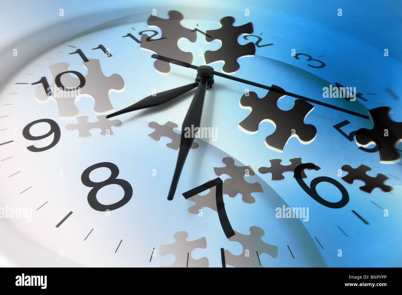 Clock and Jigsaw Puzzle Pieces Stock Photo - Alamy