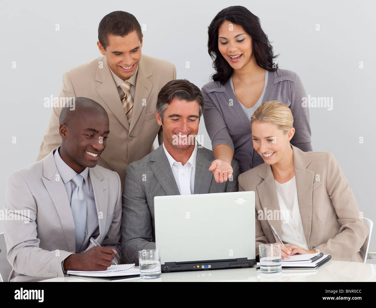 Business team working in office together Stock Photo - Alamy