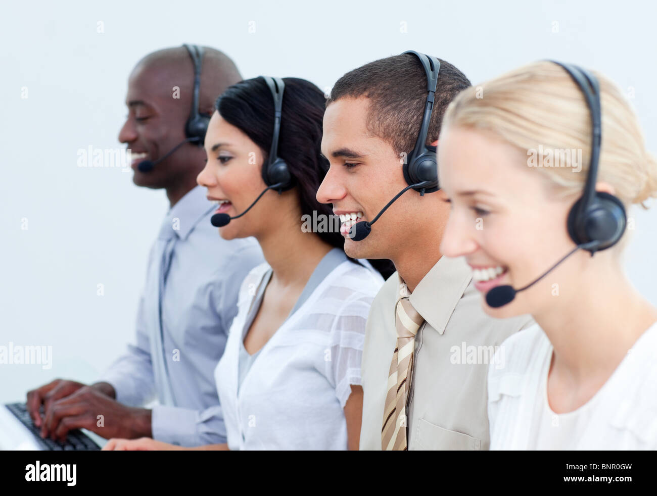 Positive business people working in a call center Stock Photo - Alamy