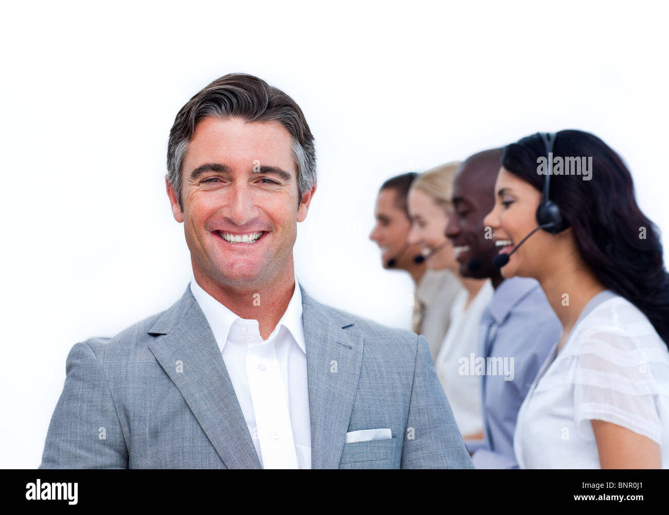 Relaxed business team working in a office Stock Photo - Alamy