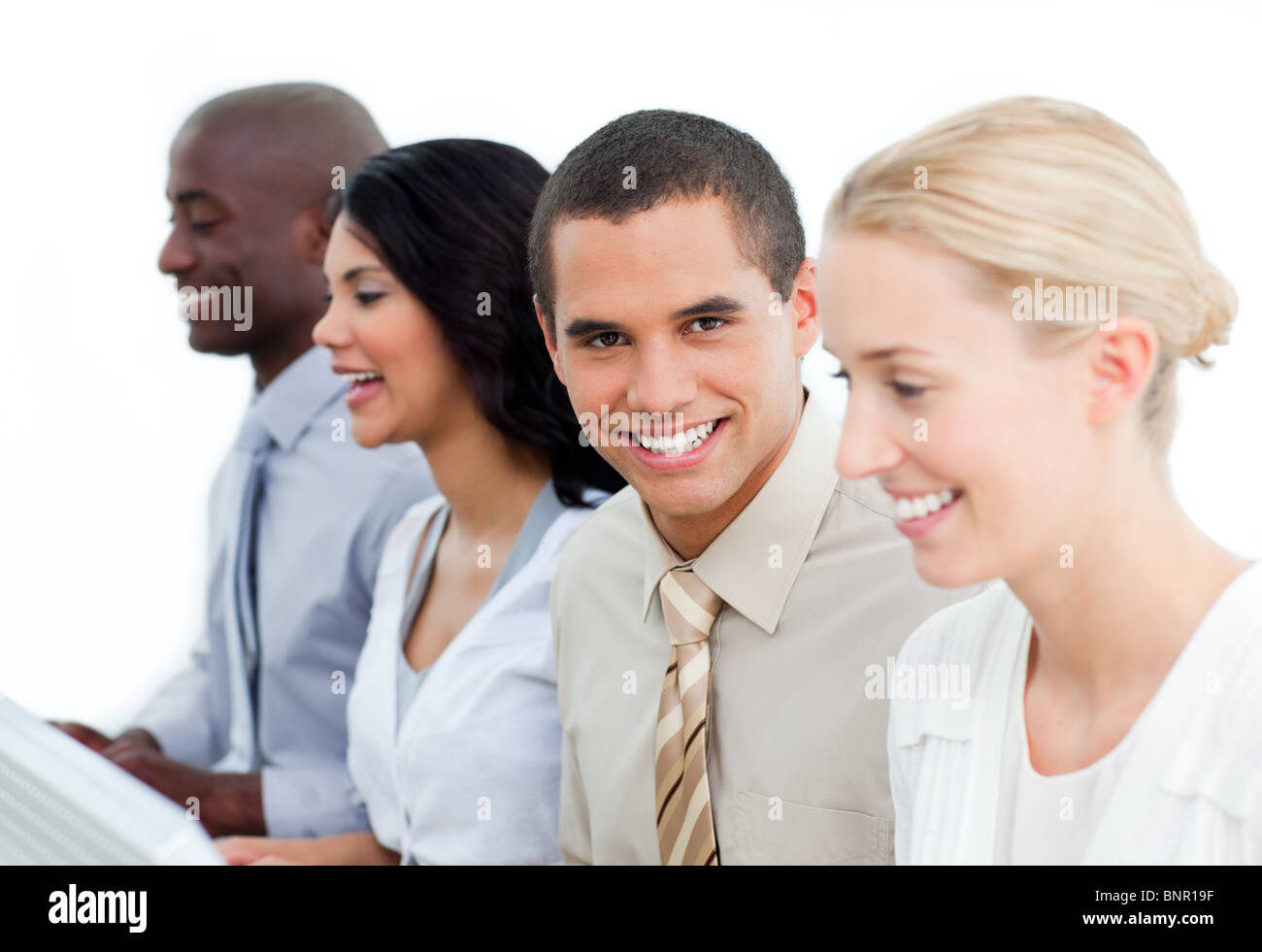 Happy business team working in the office Stock Photo - Alamy