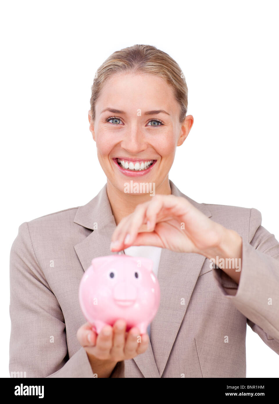 Assertive businesswoman saving money in a piggybank Stock Photo - Alamy