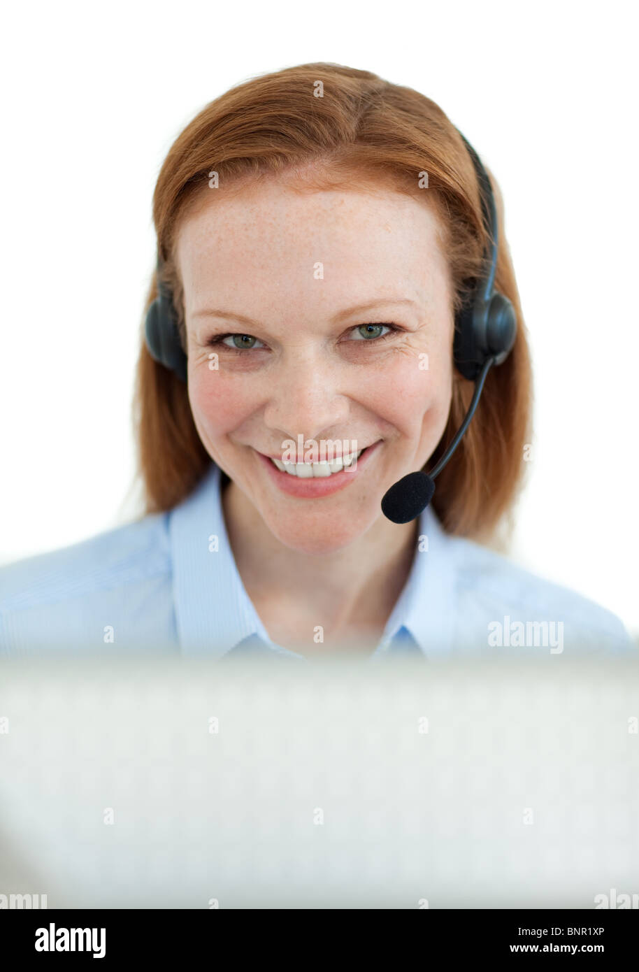 Smiling customer service agent with headset on Stock Photo - Alamy
