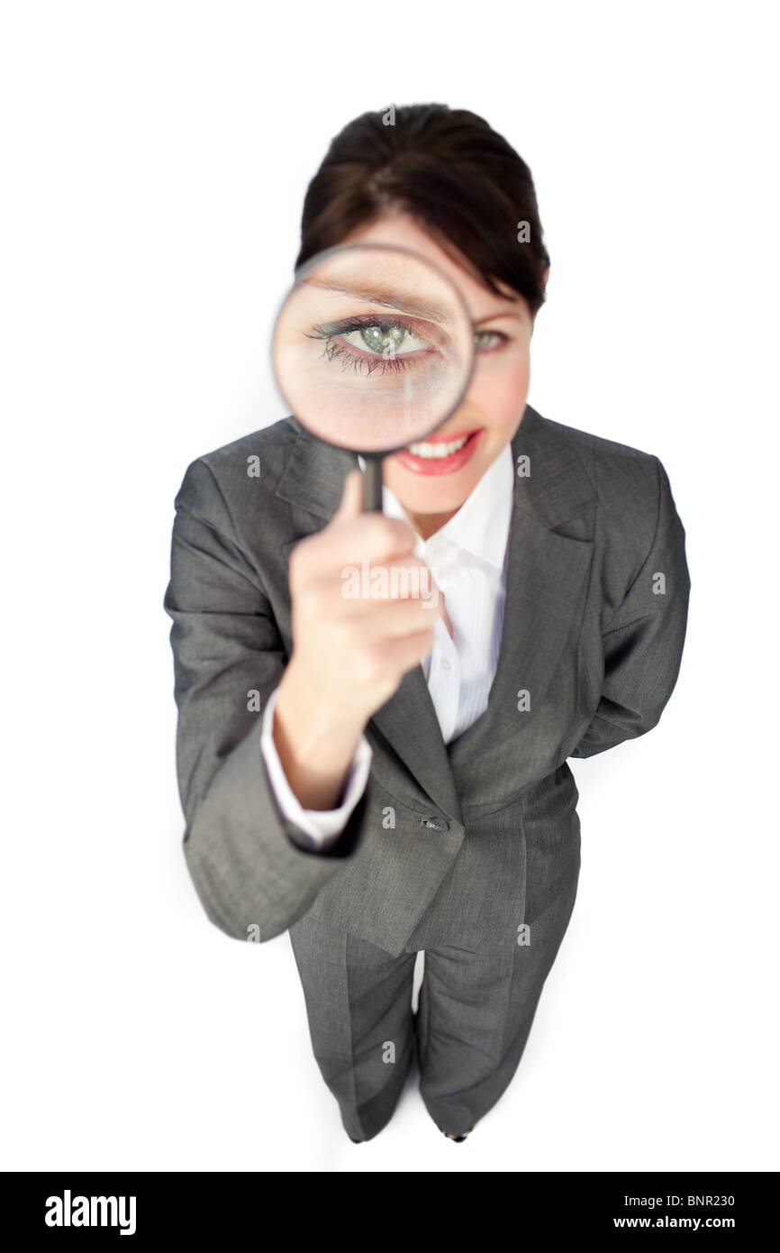 Young businesswoman looking through magnifying glass Stock Photo - Alamy