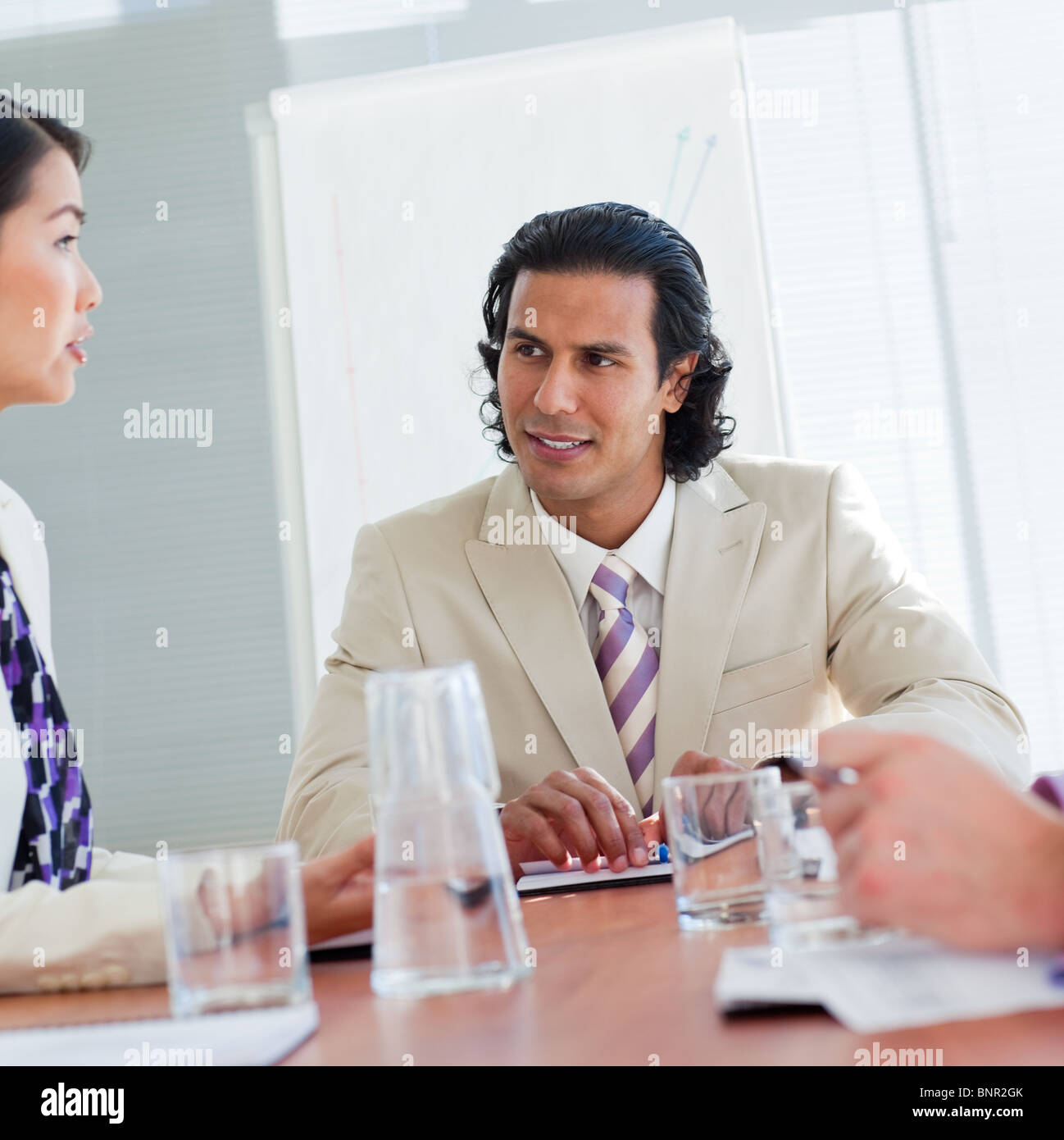 Positive manager talking with his team Stock Photo - Alamy
