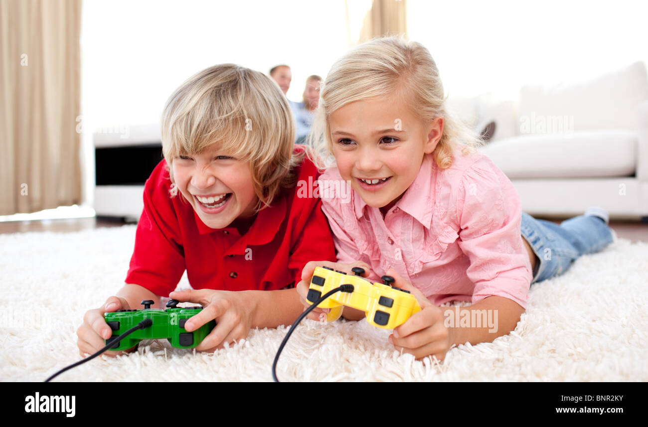 Adorable Children playing video games Stock Photo - Alamy