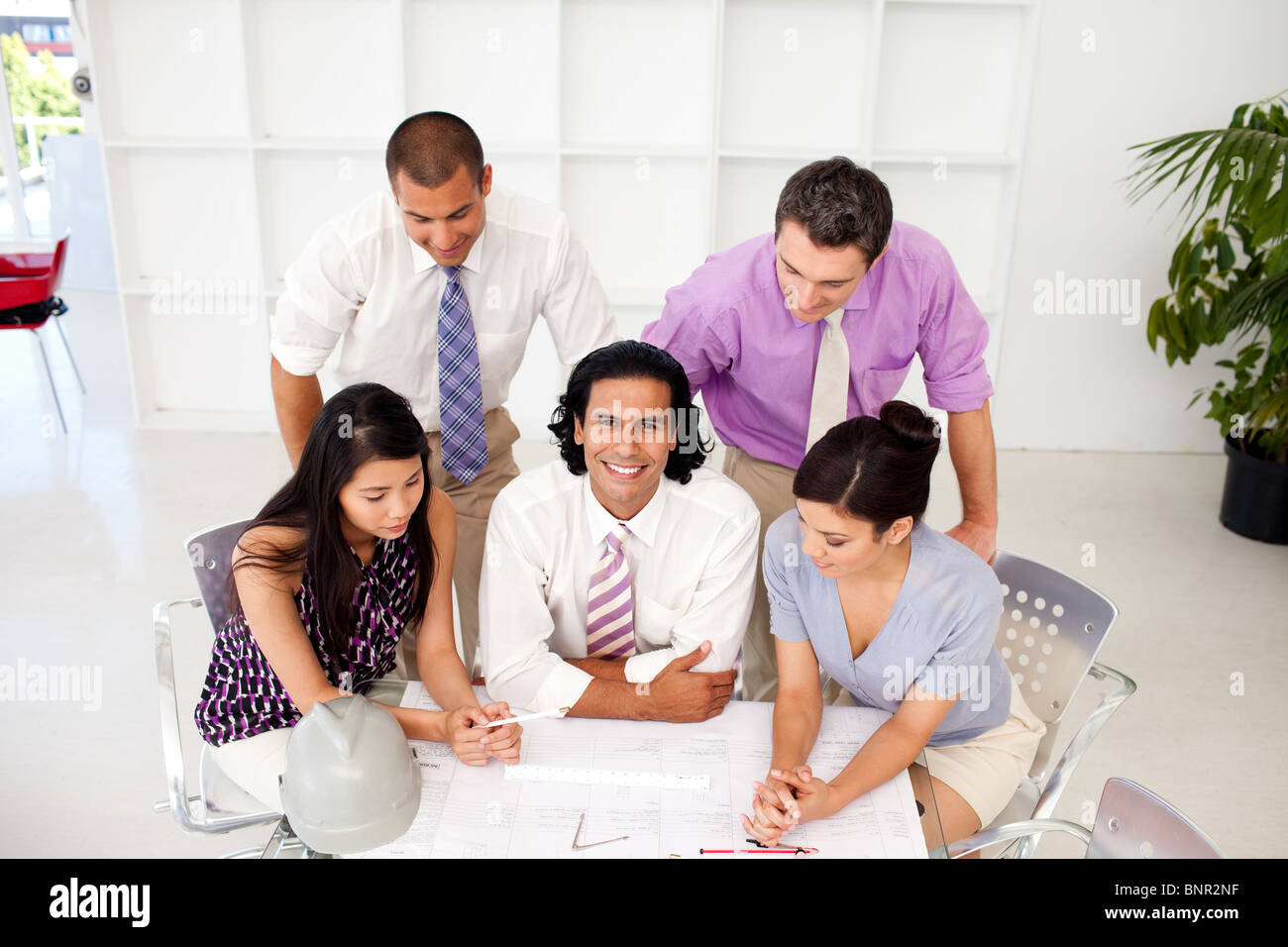 A diverse group of engineers smiling at the camera Stock Photo - Alamy