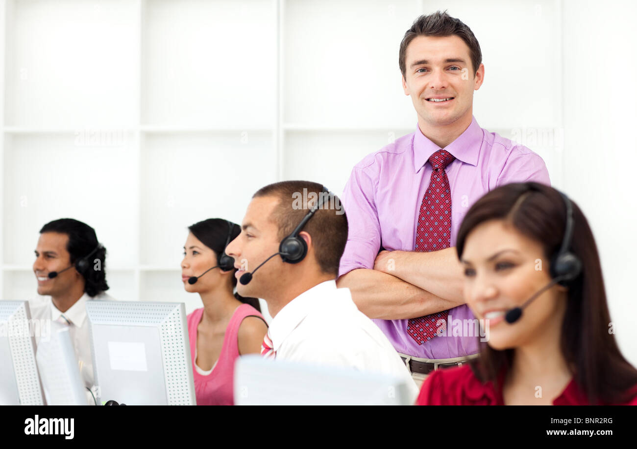 Confident manager checking his employee's work Stock Photo - Alamy