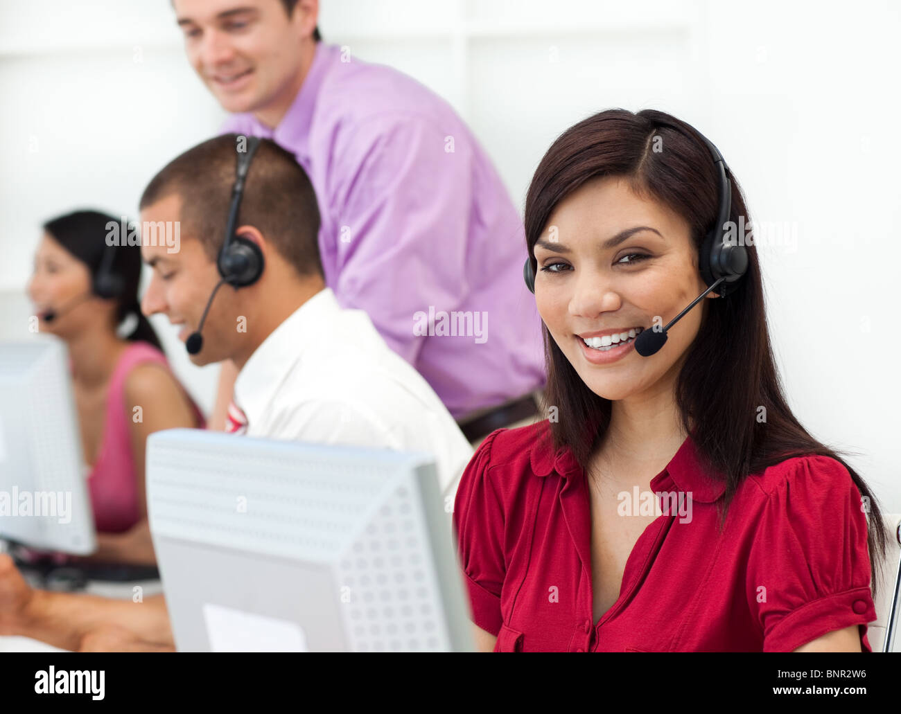 Positive Customer service representative using headset Stock Photo - Alamy