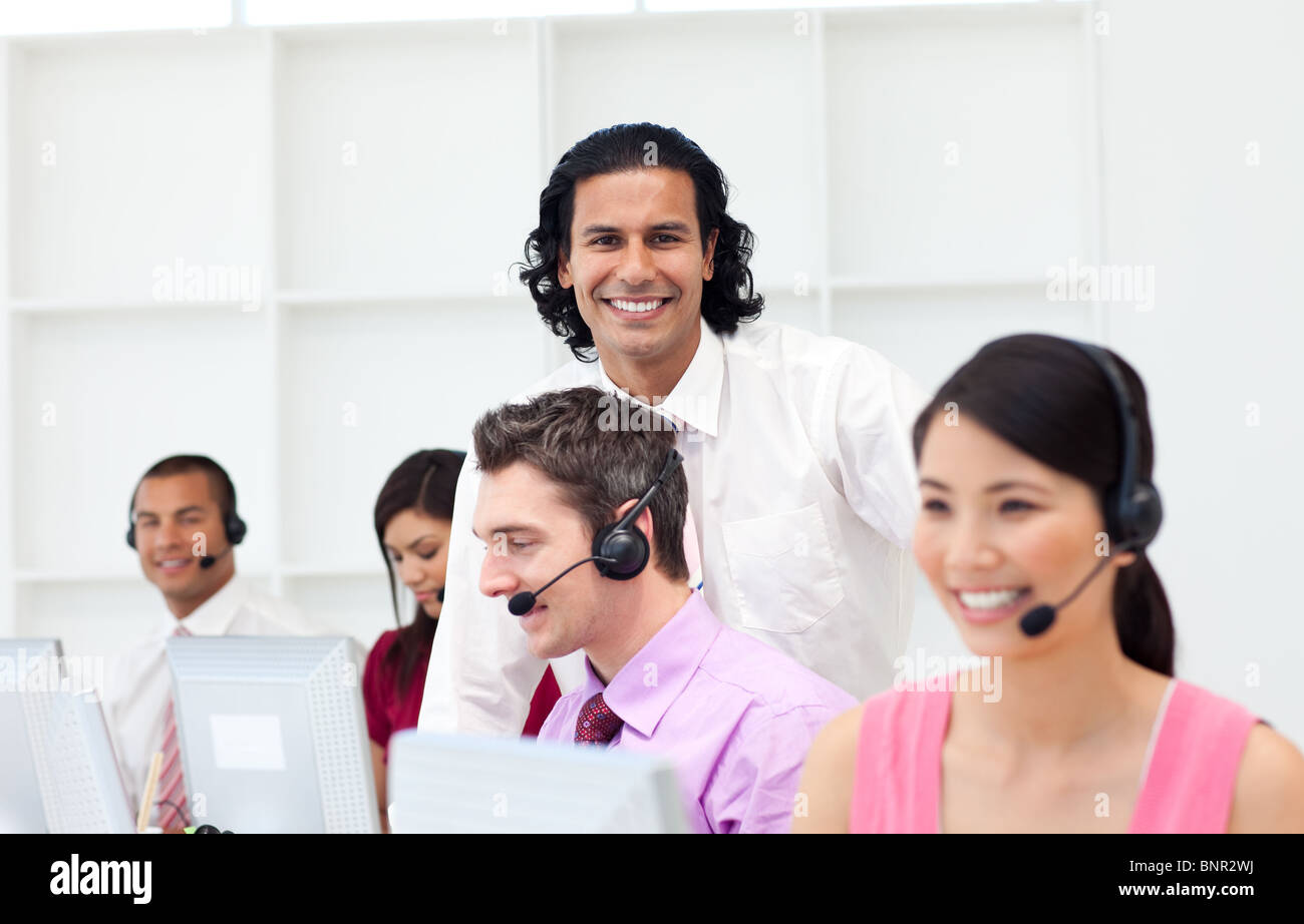 Smiling manager checking his employee's work Stock Photo - Alamy