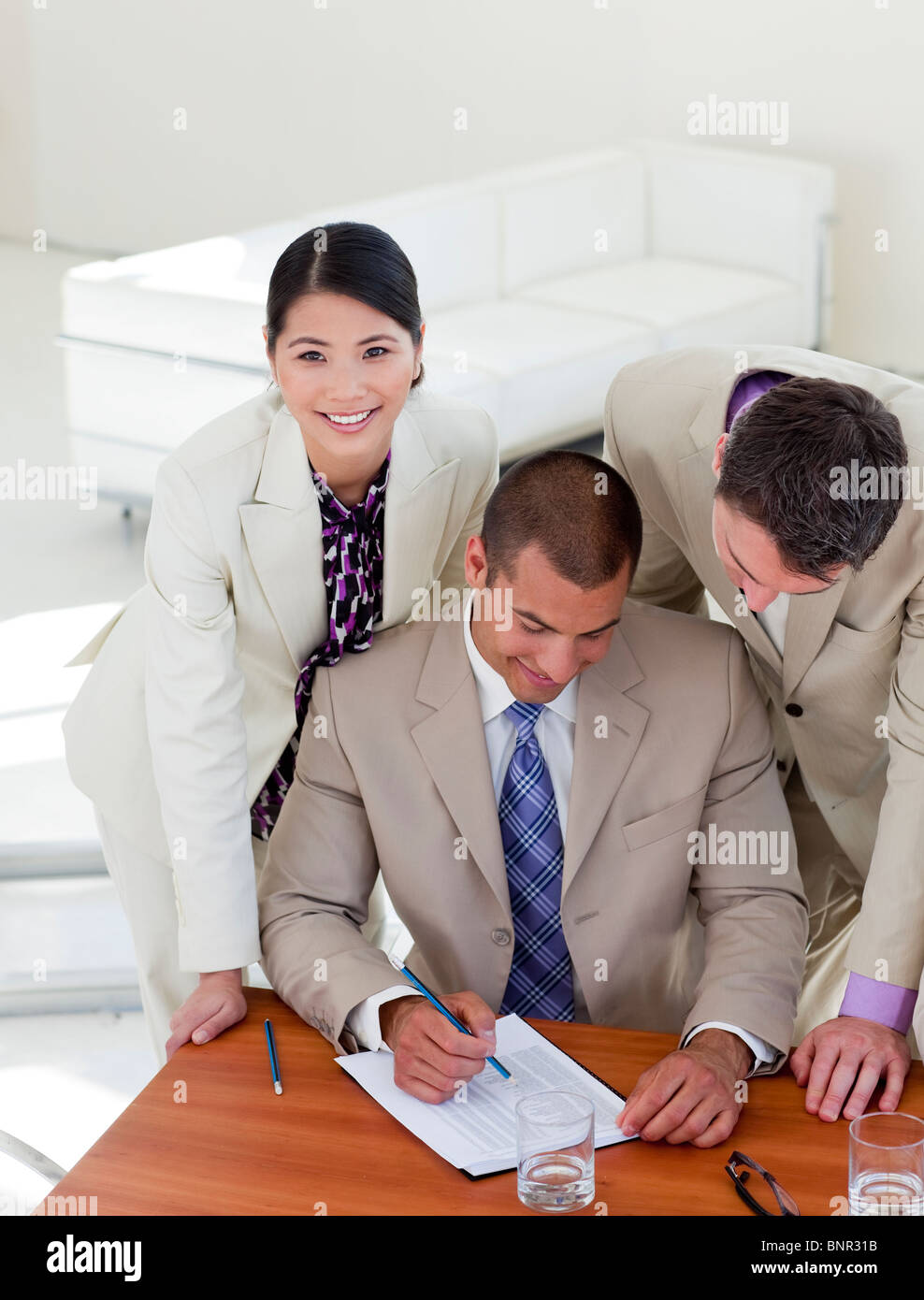 Concentrated business people working together Stock Photo - Alamy