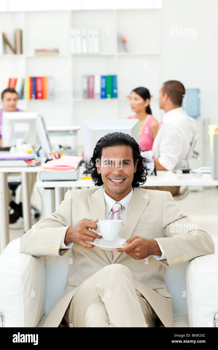 Manager drinking a coffee Stock Photo - Alamy