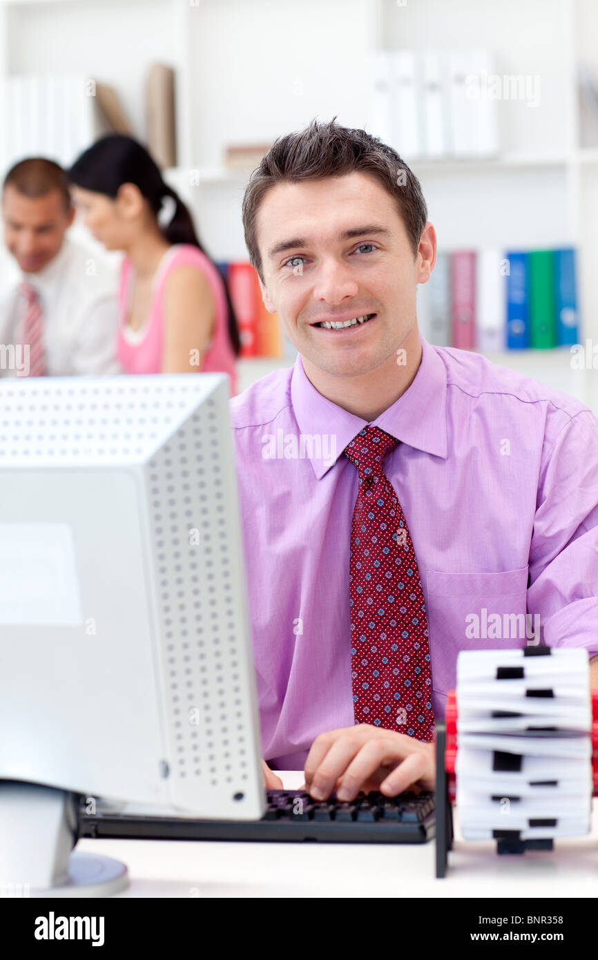 Portrait of a confident businessman working at his computer Stock Photo ...
