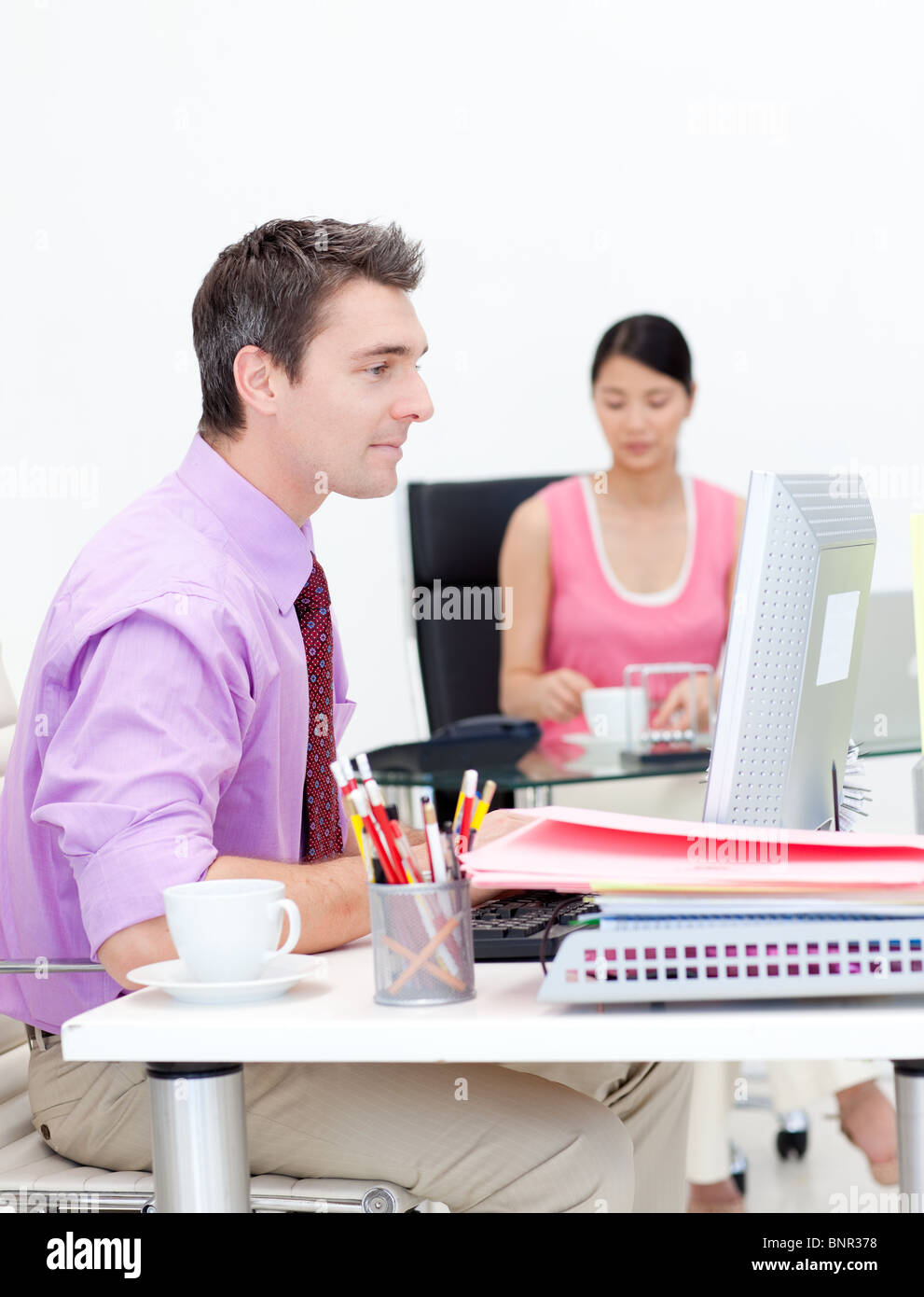 Portrait of business people working Stock Photo - Alamy