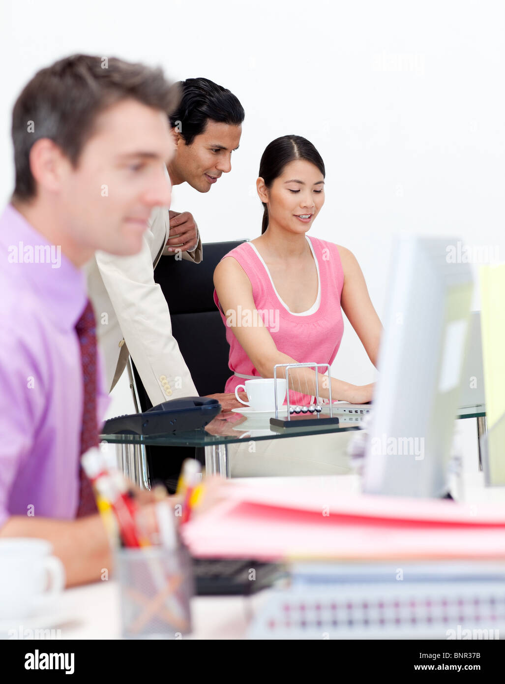 Manager checking his team work Stock Photo - Alamy