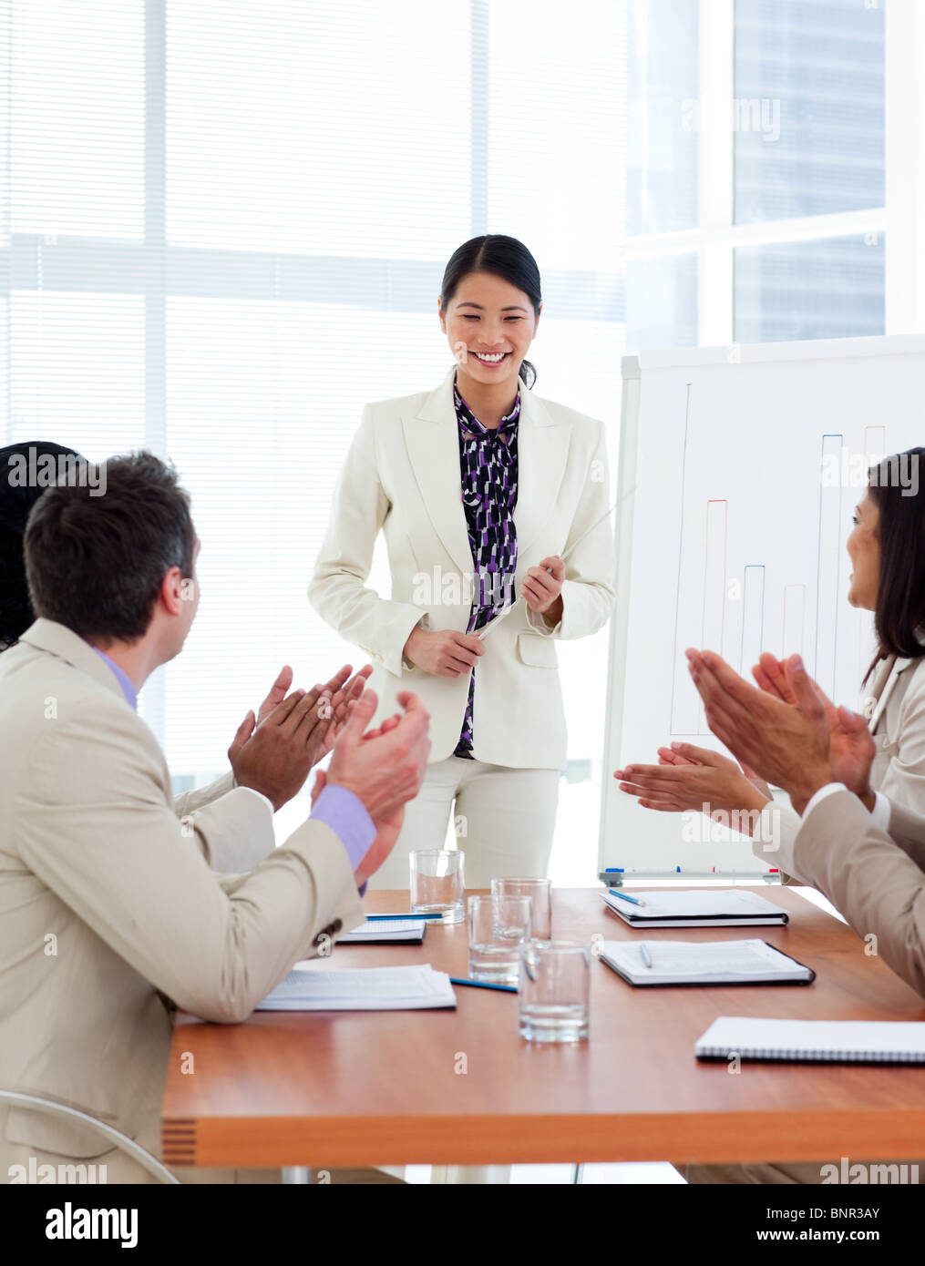 Successful woman giving a presentation Stock Photo - Alamy