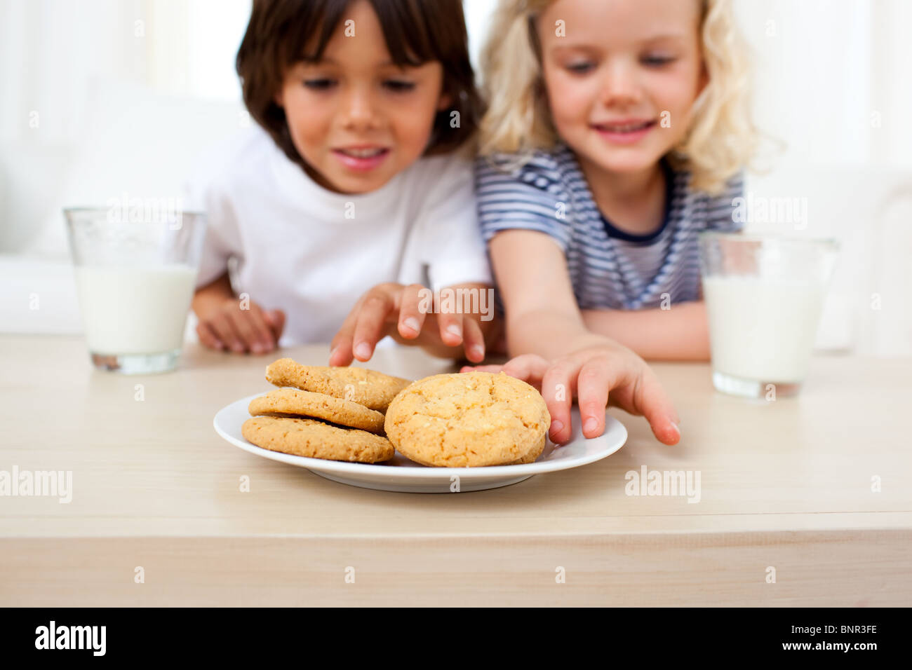 Child stealing biscuits hi-res stock photography and images - Alamy