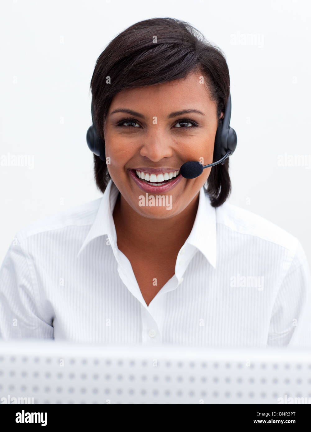 Young customer service agent with headset on Stock Photo - Alamy