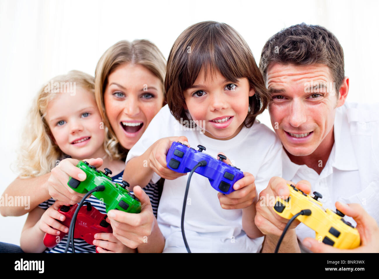 Animated family playing video game Stock Photo - Alamy