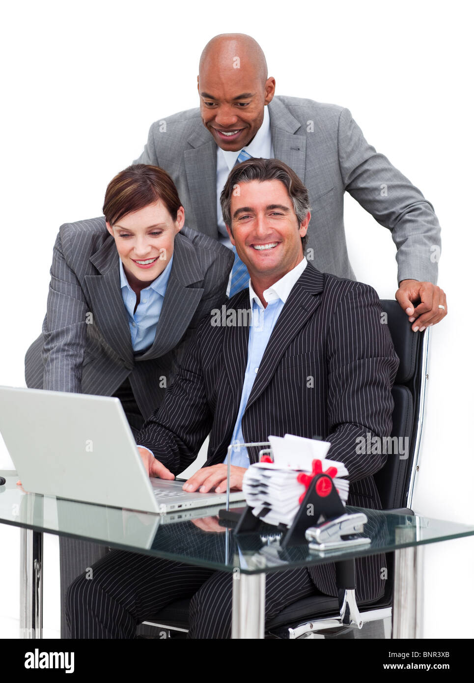 Jolly business team working at a computer Stock Photo - Alamy