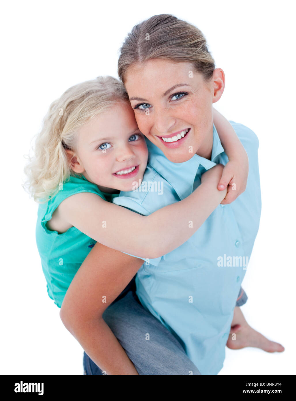 Blond mother giving her daughter piggyback ride Stock Photo - Alamy