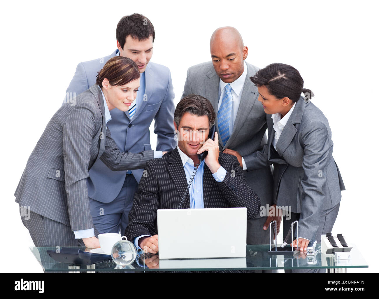 Assertive manager on phone and his team Stock Photo - Alamy