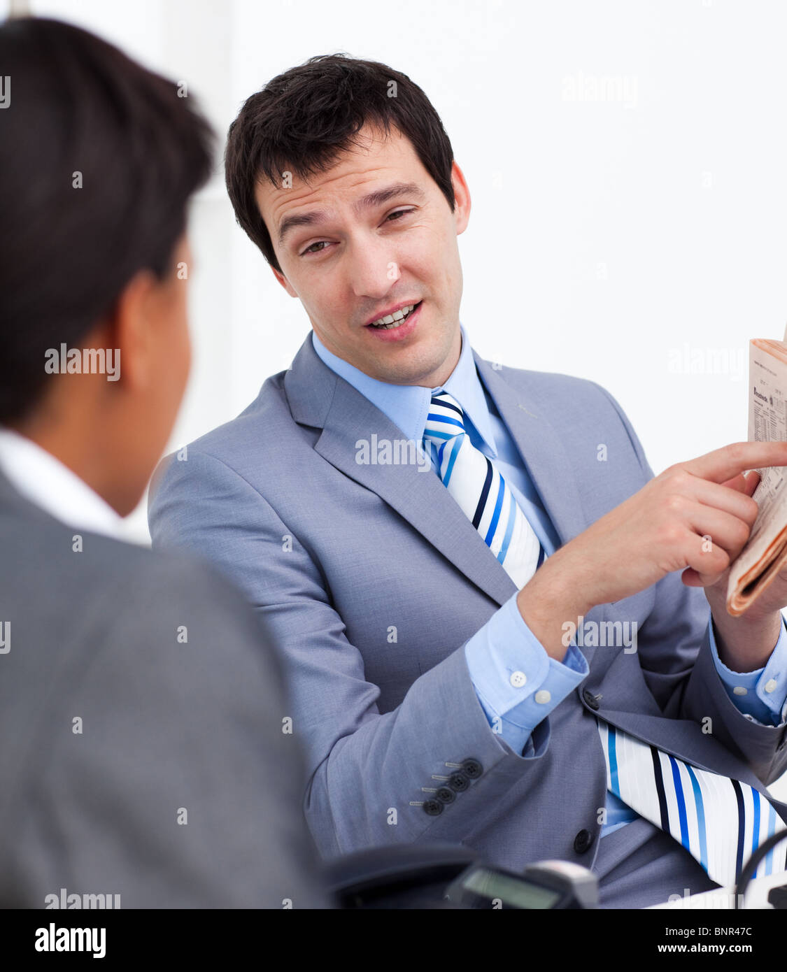 Two colleagues talking about news Stock Photo - Alamy Two colleagues talking about news Stock Photo - Alamy