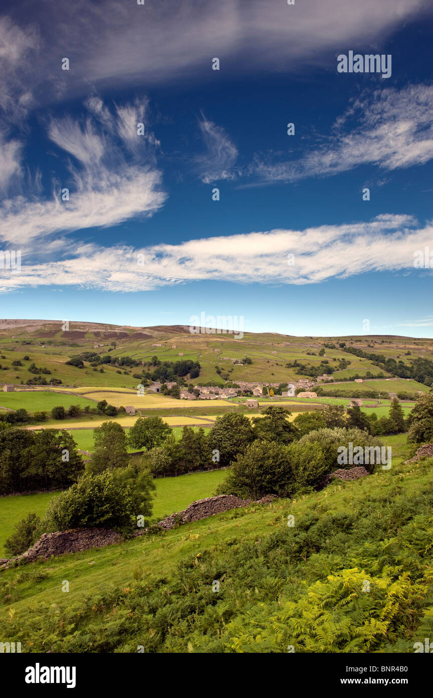 looking accross River Swale towards Gunnerside village in Swaledale ...