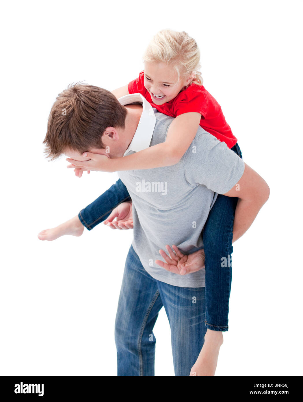 Lively father giving his daughter piggyback ride Stock Photo - Alamy