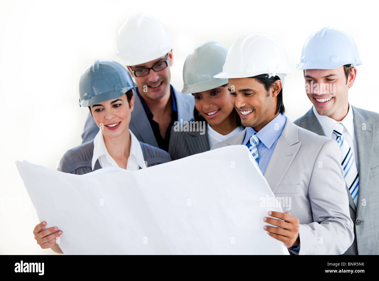 Architects studying a blueprint Stock Photo - Alamy