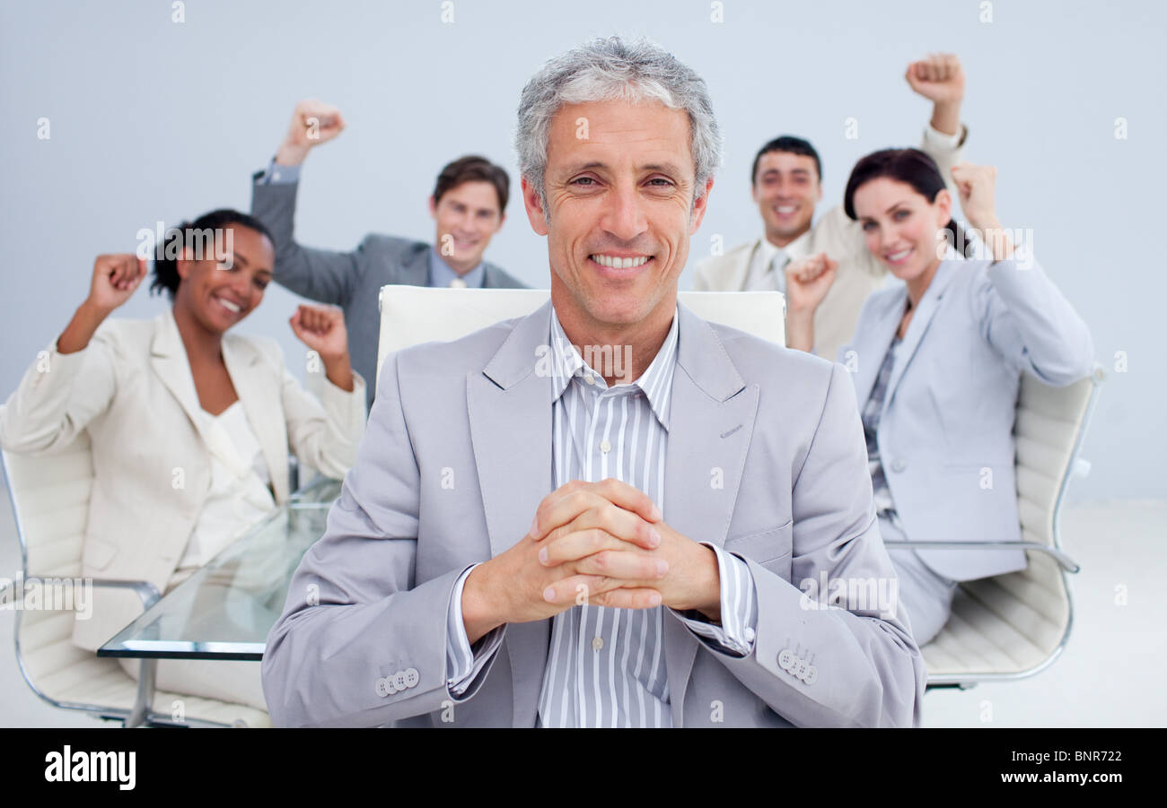 Happy manager and business team celebrating a sucess Stock Photo - Alamy