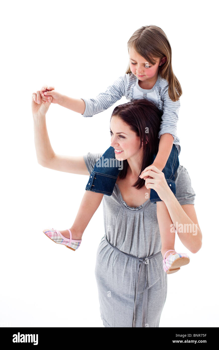 Merry mother giving her daughter piggyback ride Stock Photo - Alamy