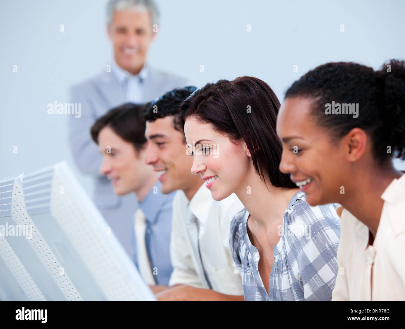 Concentrated business team at work with their manager Stock Photo - Alamy