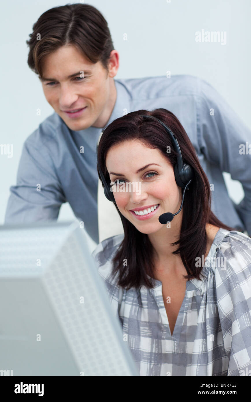 Young manager checking his employee's work Stock Photo - Alamy