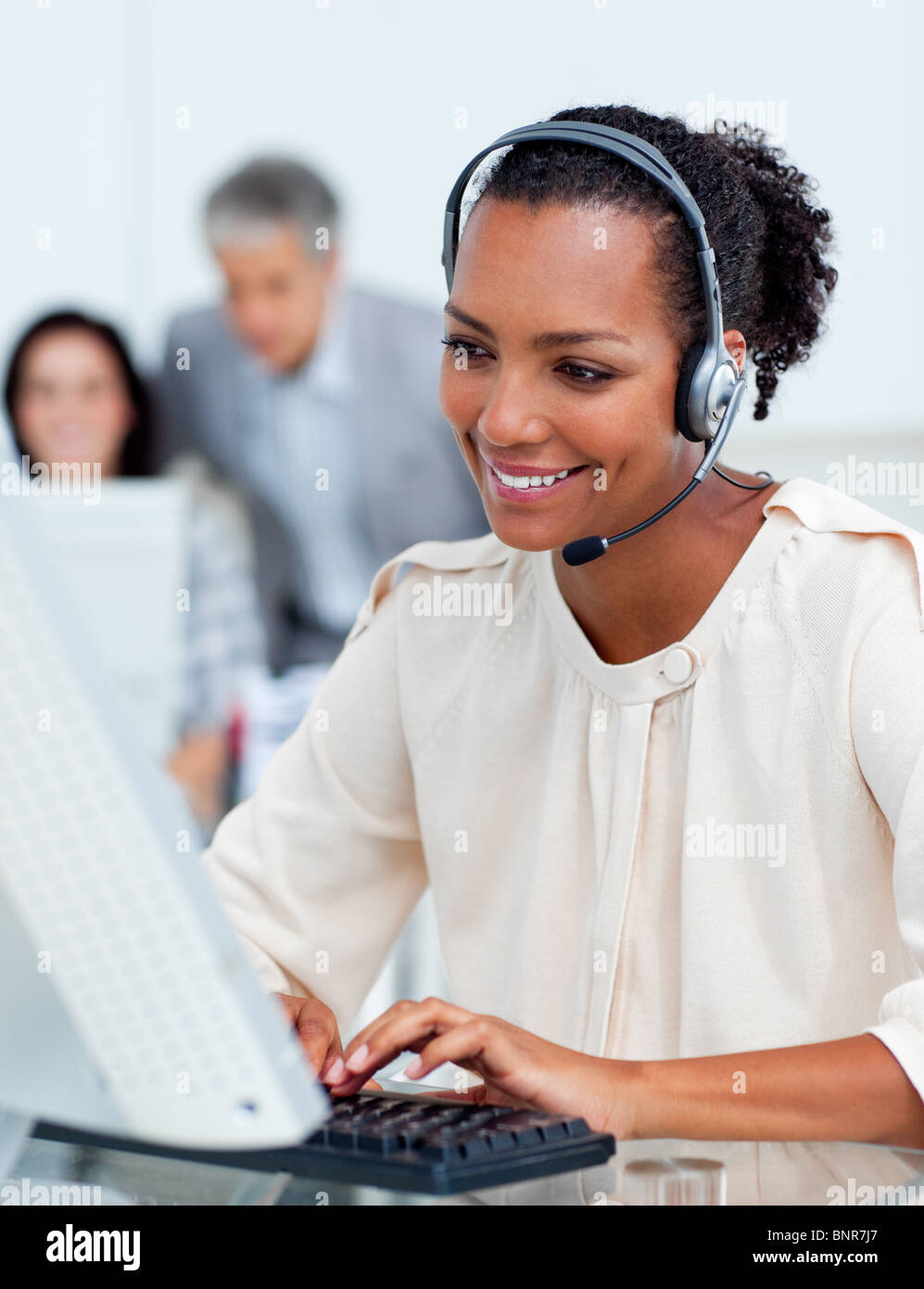 Concentrated business people working at computers Stock Photo - Alamy