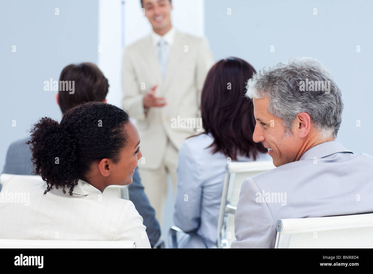 Two business people interacting at a conference Stock Photo - Alamy