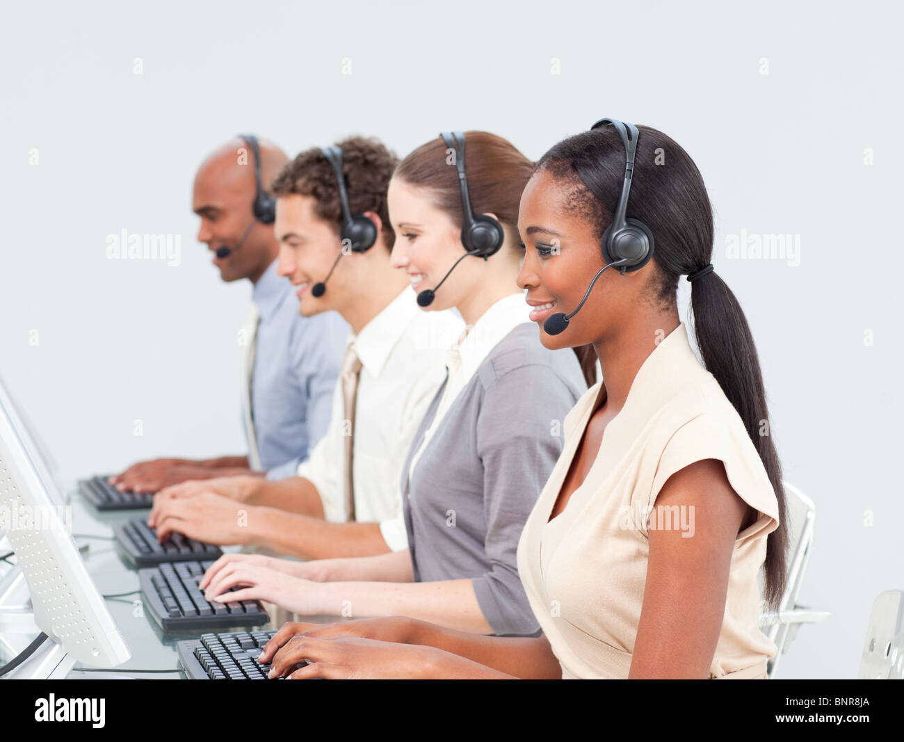 Concentrated business team working in a call center Stock Photo - Alamy