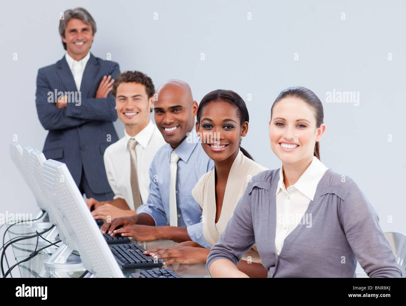 Happy customer service representatives in a call-center Stock Photo - Alamy