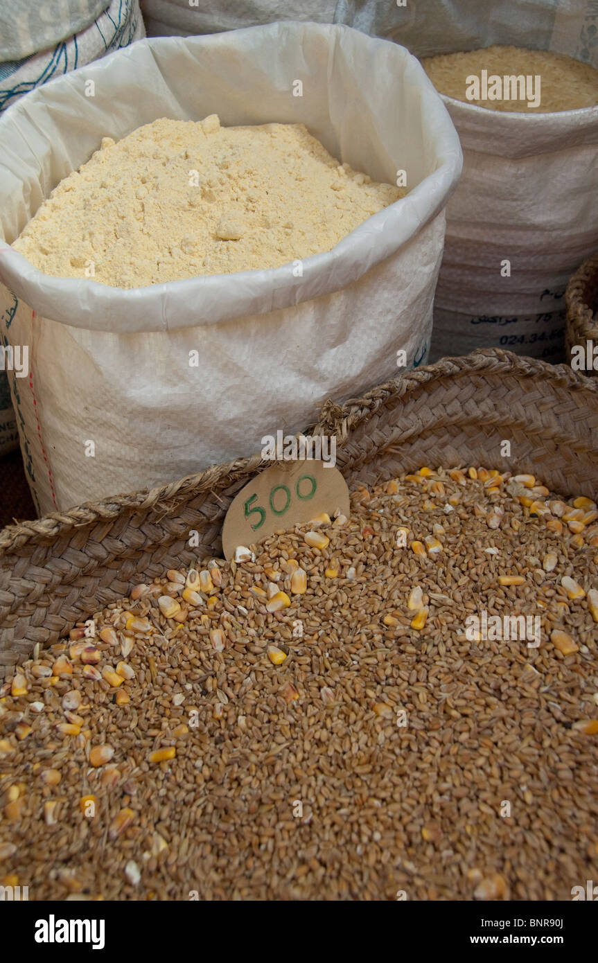 Morocco, Tetouan. Historic Medina bazaar. Assorted grains in basket ...