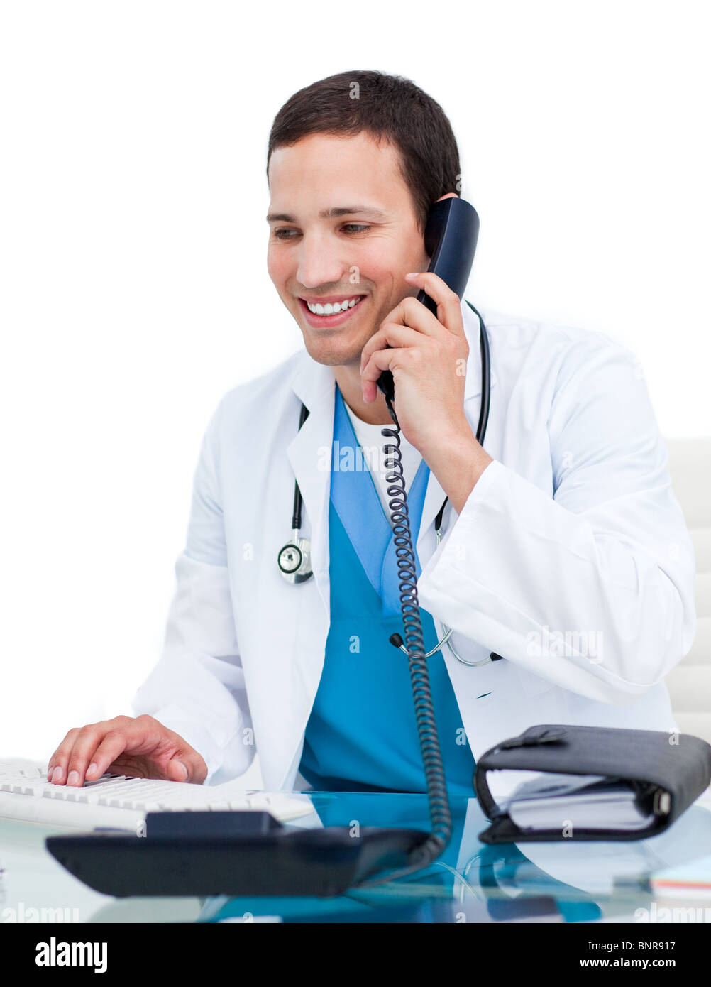 Doctor answering phone call using hi-res stock photography and images ...