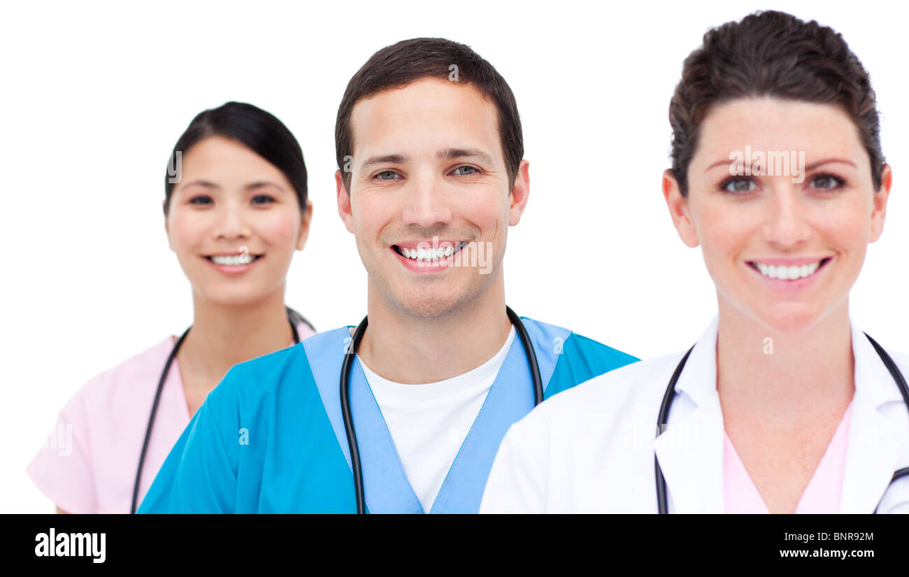 Smiling medical team against a white background Stock Photo - Alamy