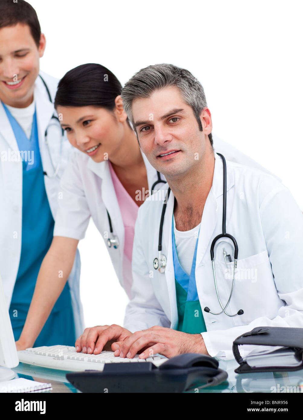 Handsome doctors and nurse working at computer Stock Photo - Alamy