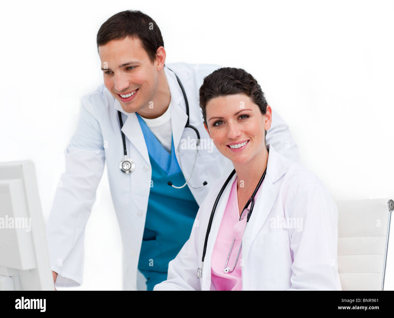 Male doctor and nurse working at computer Stock Photo - Alamy