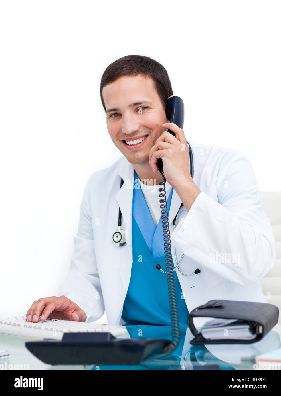 Smiling doctor calling Stock Photo - Alamy
