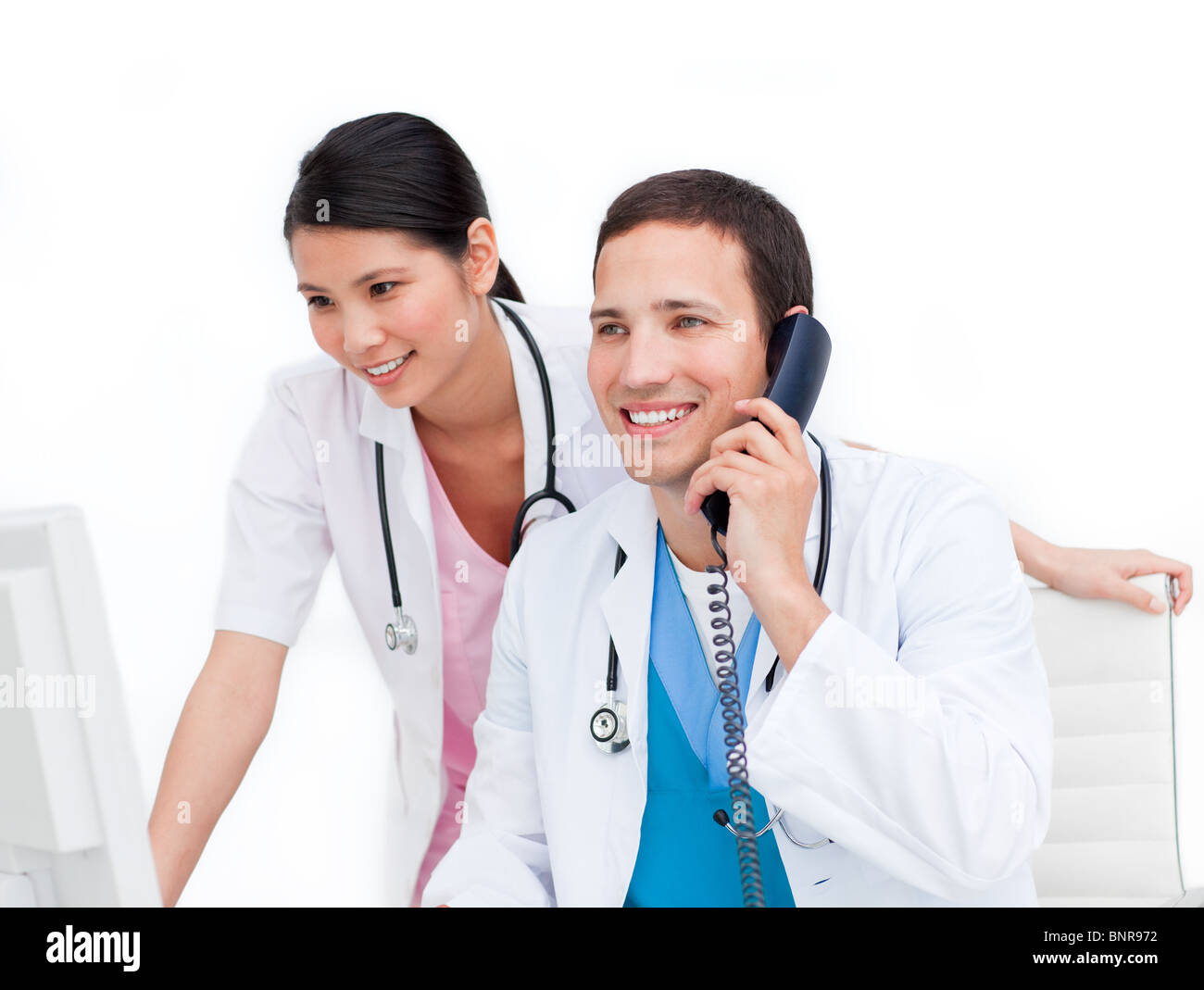 Female nurse and male doctor calling Stock Photo - Alamy