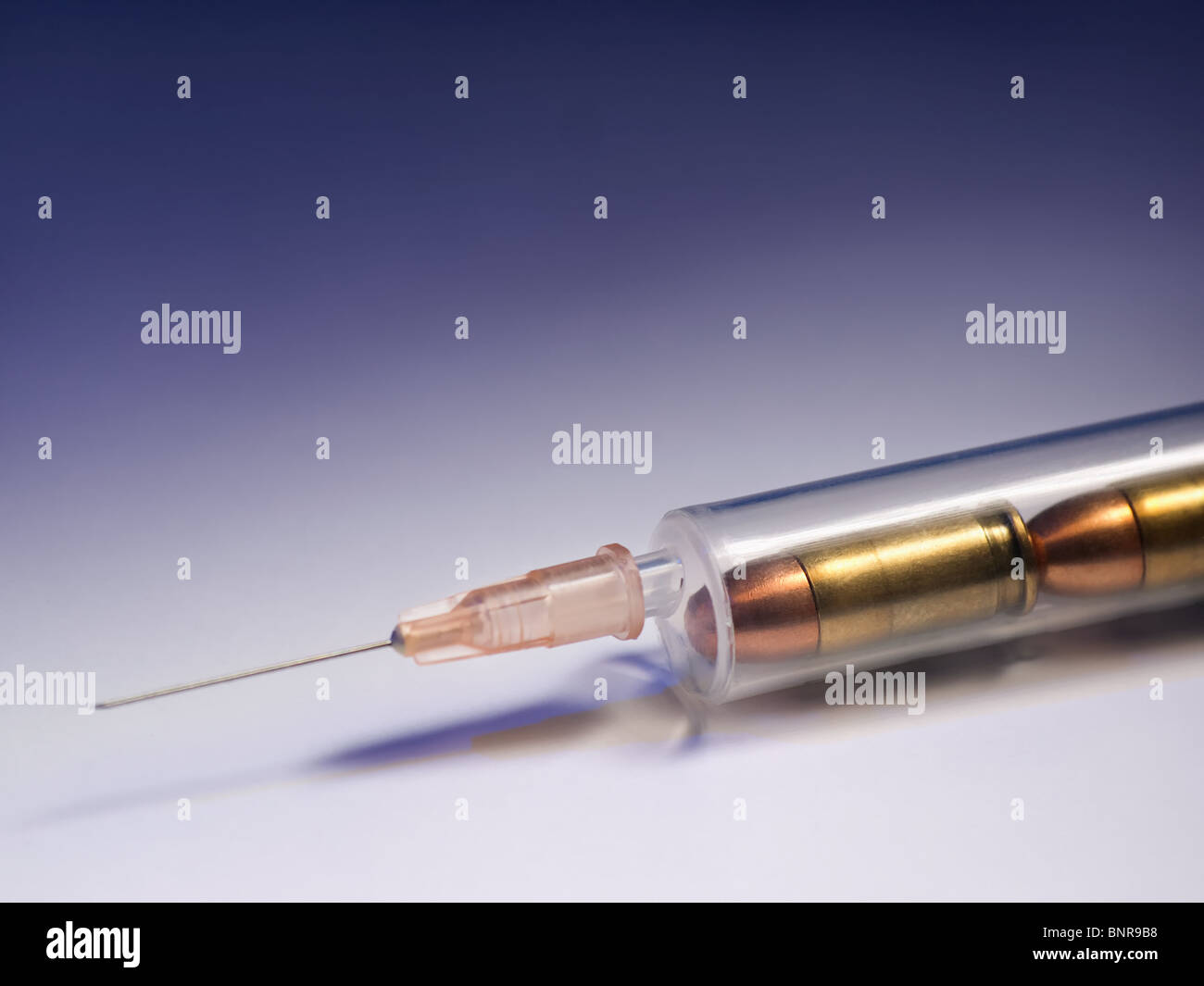 syringe with the bullets inside, conceptual shot for various ...