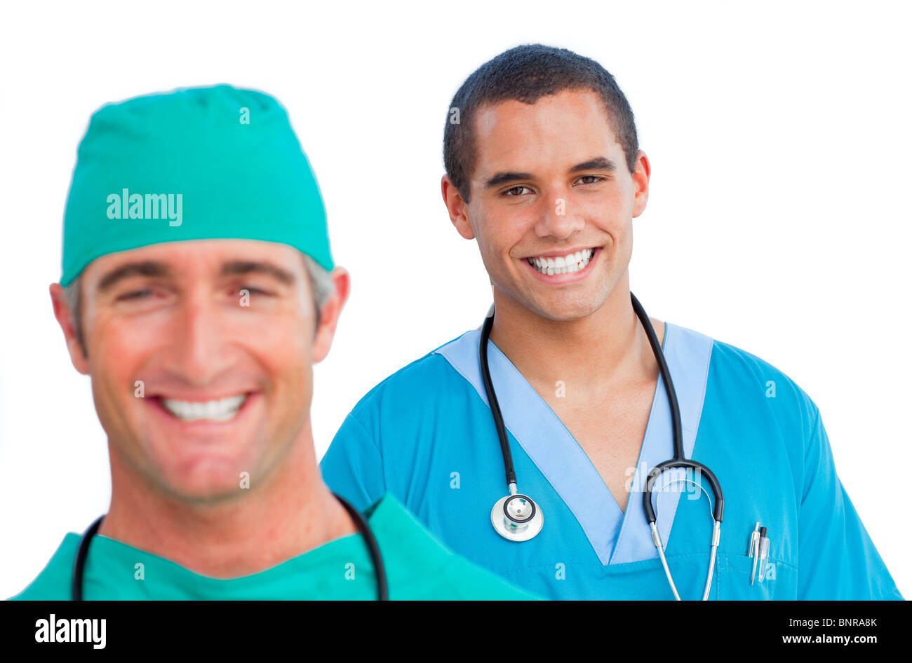 Two nice doctors smiling at the camera Stock Photo - Alamy