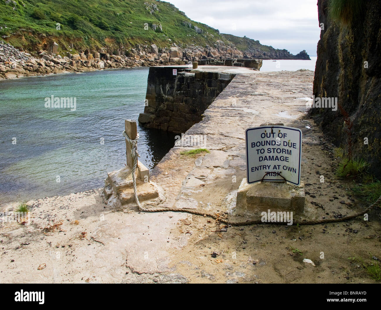 The damaged quay in Lamorna Cove in Cornwall Stock Photo - Alamy