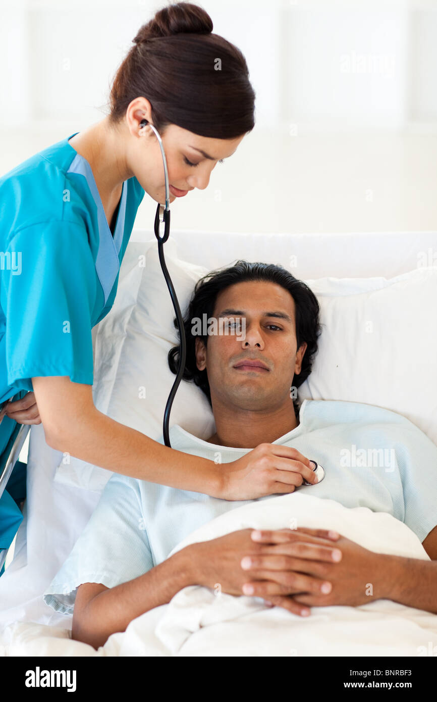 Confident doctor checking the pulse of a patient Stock Photo - Alamy